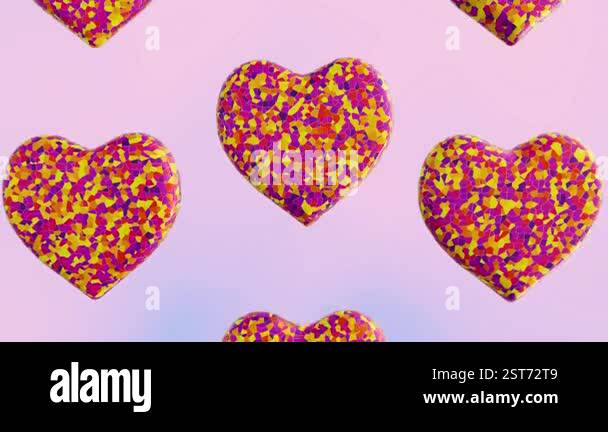 A 3D animation of falling heart shapes with a pink mosaic pattern ...