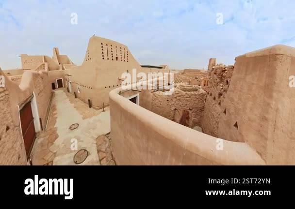 aerial view featuring traditional mud-brick architecture, ancient alleyways of Diriyah, a UNESCO ...
