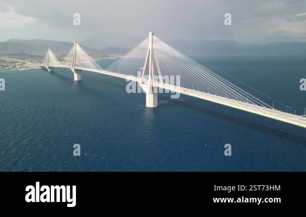 A breathtaking perspective of a long bridge stretching over tranquil ...