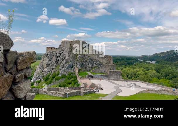 A stunning view of a historic hilltop castle surrounded by lush green ...