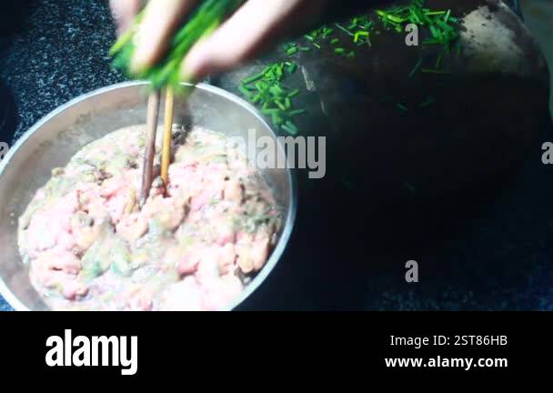 make fried eggs with minced meat Stock Video Footage - Alamy