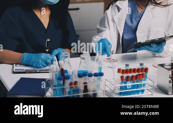 female scientist with syringe in laboratory Stock Video Footage - Alamy