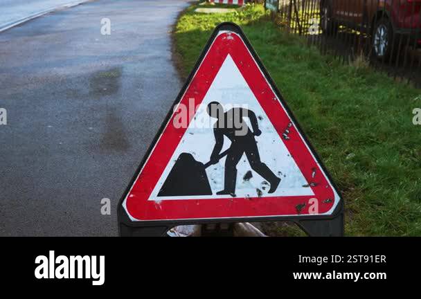 Road maintenance warning sign in United Kingdom. Traffic control board ...
