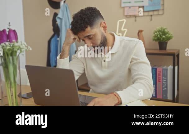 Anxious hispanic man with a beard in a white shirt feeling stressed ...