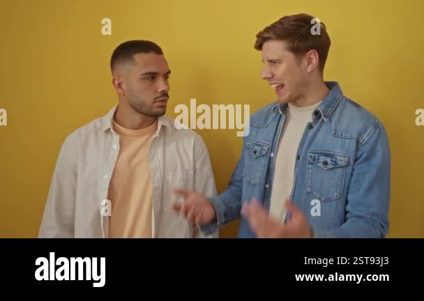 Two men in a friendly interaction, with one shouting and the other ...