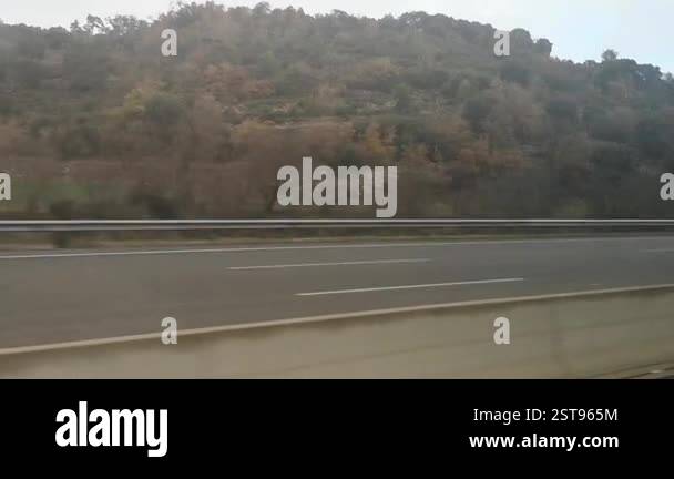 A view through a bus window captures autumn landscapes in Catalonia ...