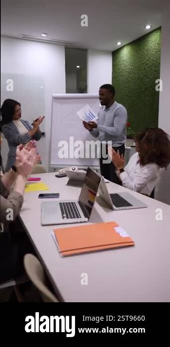 Professional diverse team applauding with enthusiasm after successful ...