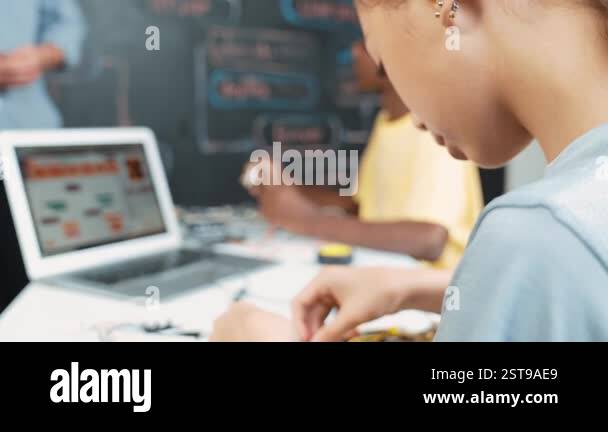 Teacher teaching about coding system while diverse academic student ...