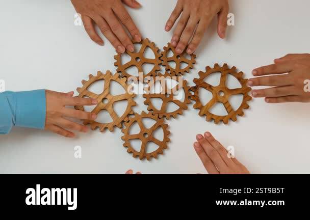 Panorama video of wooden cogwheel gear separate each other symbolize ...