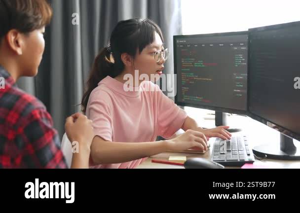 Slow motion back end software developer engineer for computer programming working together on ...