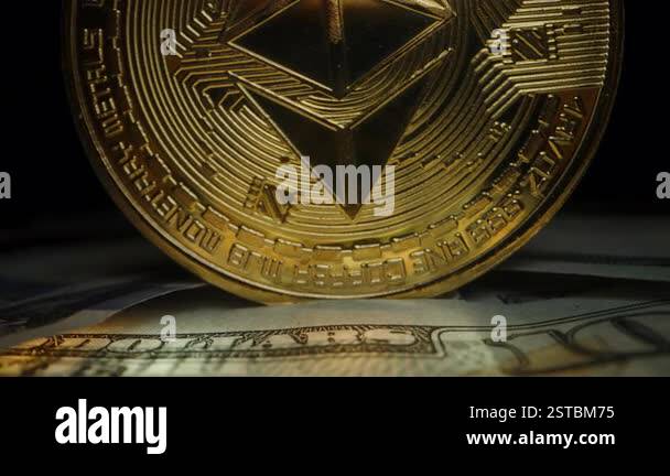 Dolly slider, close up. Golden Ethereum Coin Standing Upright on US ...