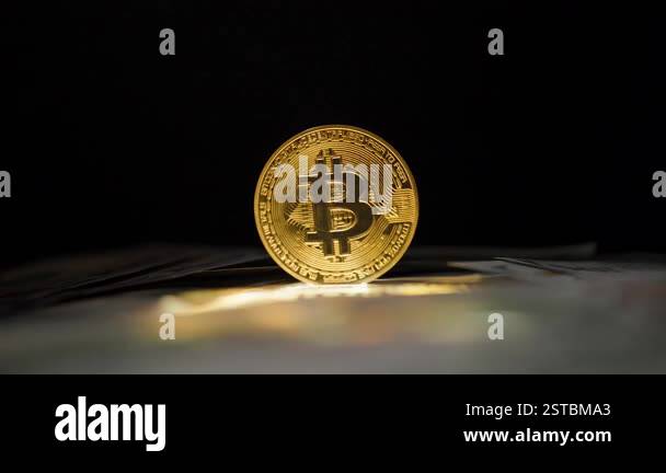 Golden Bitcoin Coin Illuminated by Flickering Light on a Dark Surface ...