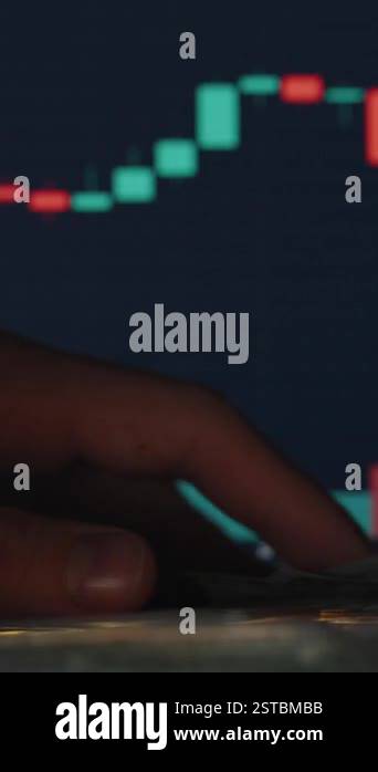 Vertical video. Hand Collecting Dollar Bills on the Table near Bitcoin ...