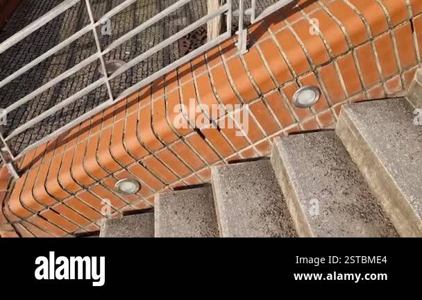 stairs and railings of exposed brick smooth surface. Metal railings and ...
