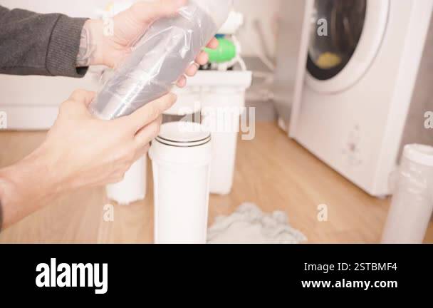 Hands Unpacking a New Carbon Filter from Protective Wrapping, Preparing ...