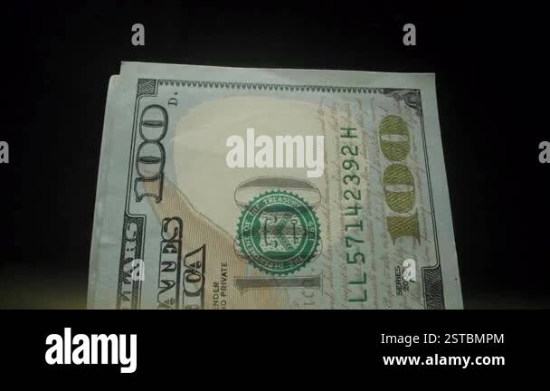 Close-Up View of a Hundred-Dollar Bill Showing Security Features and ...