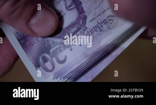 British 20 Banknotes | hands counting and sorting money visible in the ...