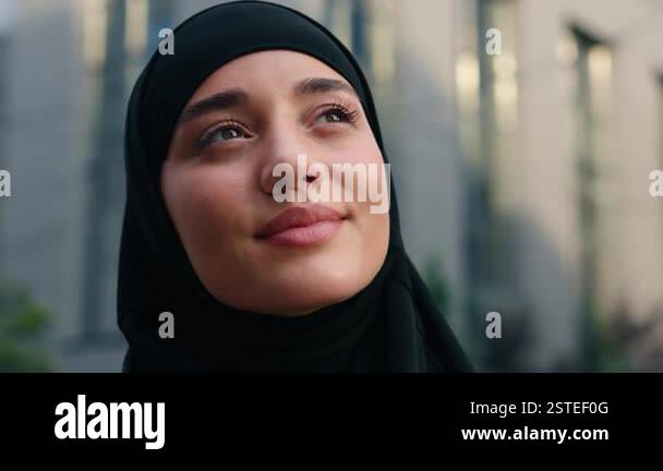 Portrait in city outdoors pensive thinking happy smiling pretty ...