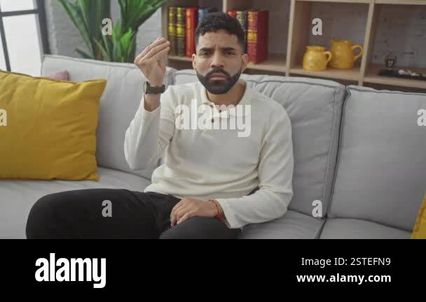 Confident young hispanic man expressing himself through italian hand ...