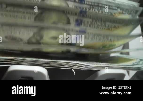 Finance and cash dollars concept. Counting dollars with electronic ...