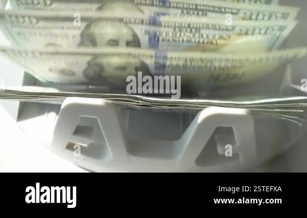 Bank equipment counting dollar paper banknotes close up. Macro of ...