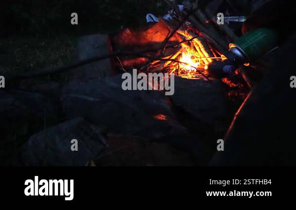 Sparks make fire, and kindling and liquid in can of ignition gas create ...