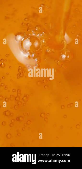 Natural Unrefined Vegetable Oil Pouring, Oil Bubbles, Macro Vertical ...