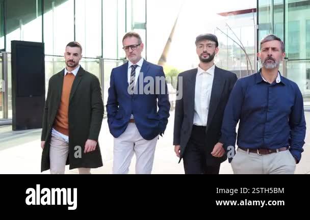 Four Distinguished Businessmen Walking Together, Exuding Confidence And ...