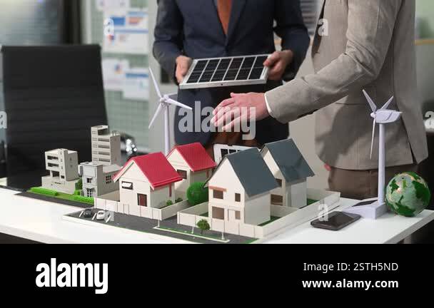 Experts collaborate on renewable energy solutions with house models ...
