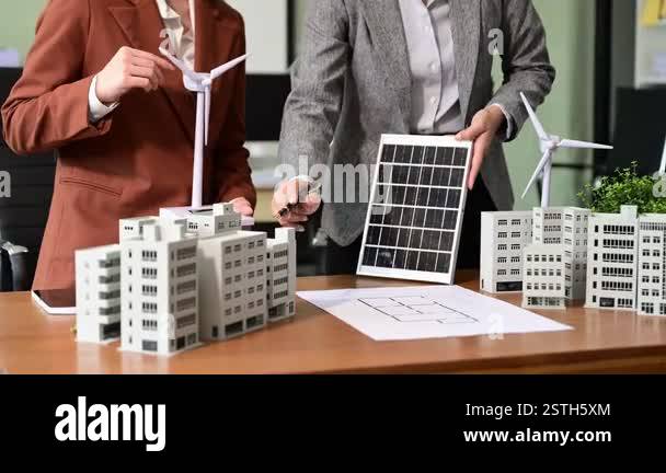 Experts collaborate on renewable energy solutions with house models ...