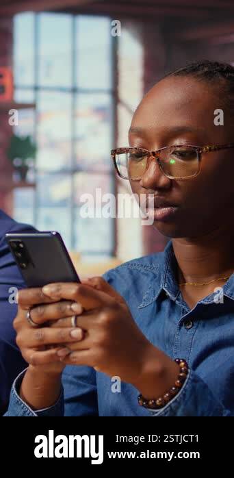 Black couple sitting together at home office and managing their affairs ...