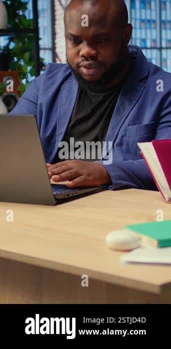 Woman Completing Spreadsheets On Notebook Entering Numerical Data Into Cells Calculating