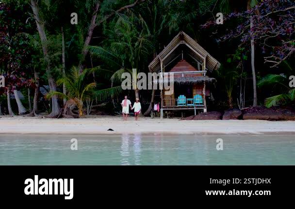 Stroll along the pristine shores of Koh Wai Island, where vibrant ...