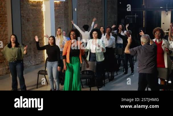 Congregation in worship, raising hands and engaging in prayer and ...