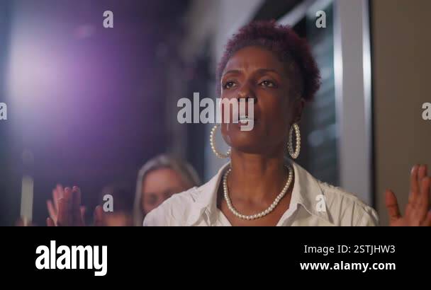 Woman performing sign of the cross with eyes closed, deep prayer ...