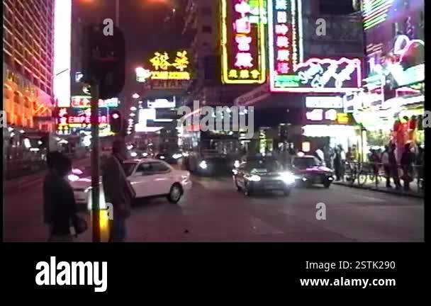 A VHS video captures the vibrant nightlife of Hong Kong, showcasing a ...