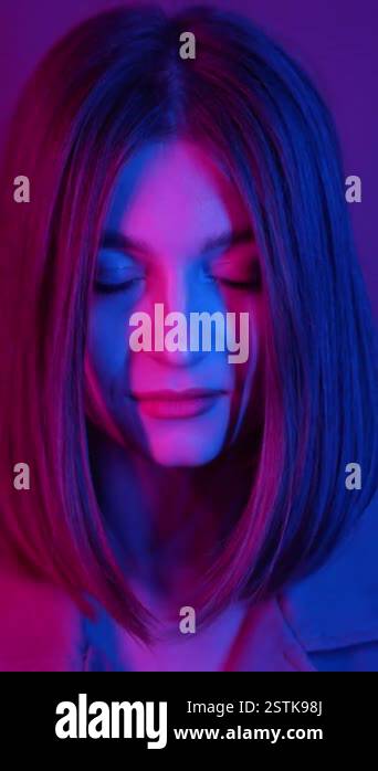 A captivating video shows a woman with red and blue hair radiating joy ...