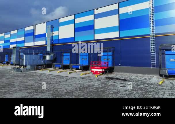 View from drone camera of big colorful industrial building ...