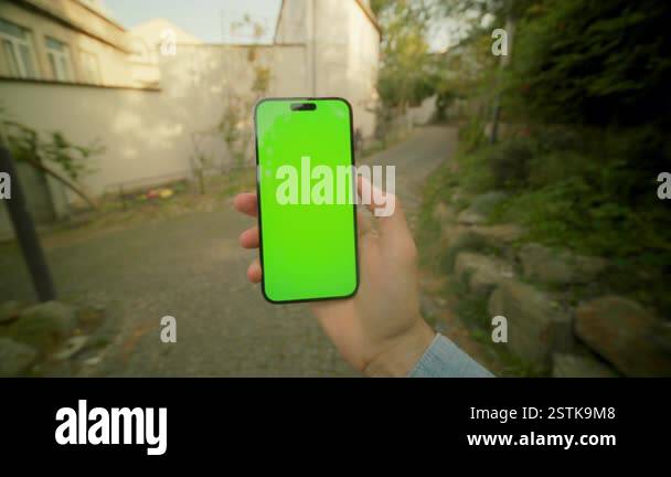 Horizontal footage of male Caucasian man with smartphone looking at ...