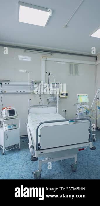 Modern ward of intensive care unit. Hospital room with bed and medical ...