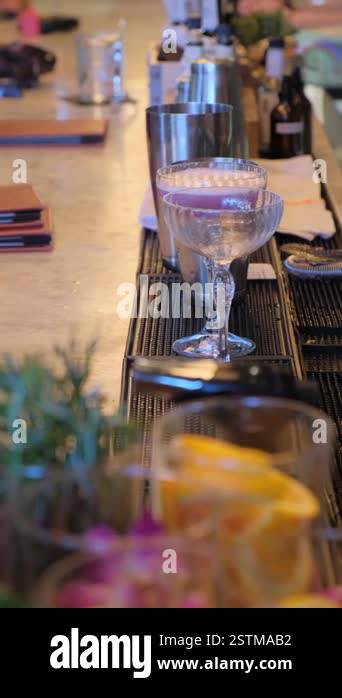 A stylish bar scene that showcases an array of unique cocktails ...