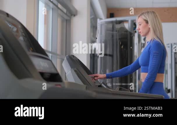 A fit and healthy woman in stylish activewear engages vigorously with a ...