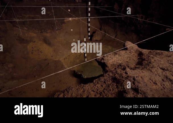 Archaeological excavation with organized measuring grid for analysis ...