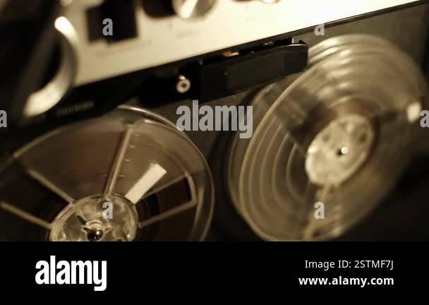 Close-up view of a vintage reel-to-reel tape recorder featuring ...