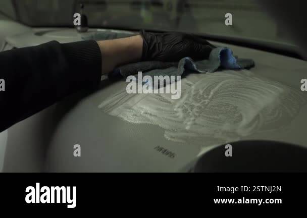 Detailing process 4k video. Worker cleans cars using microfiber cloth ...