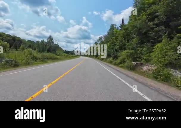 Scenic drive travel by car, front plate, driver person view POV ...