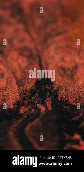 Vertical video. Sparkling glitter flow. Brilliant paint red texture ...