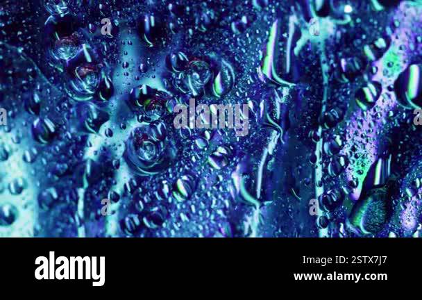 Glowing dew. Moisture metal. Colorful illuminated shiny area covered ...