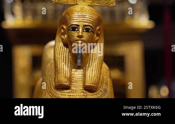 Majestic golden statue of Egyptian pharaoh stands proudly, ancient ...