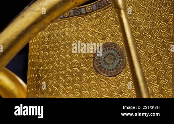 Detailed macro view of Tutankhamun parade chariot. Gilded surfaces ...